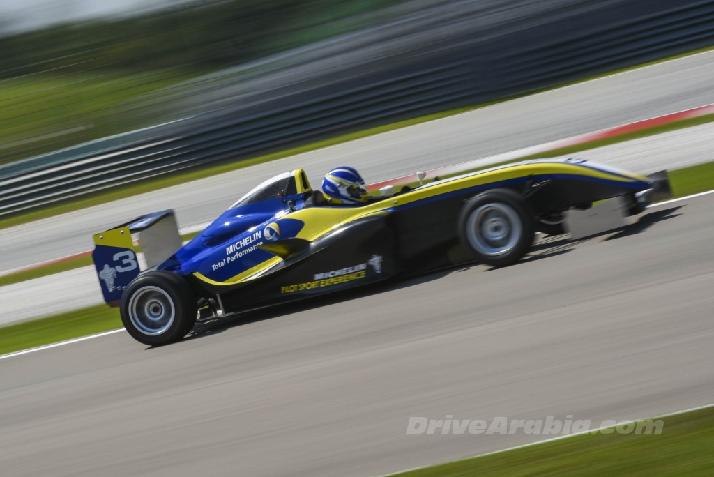 We drive Michelin racecars in Malaysia, and take 2 readers with us ...